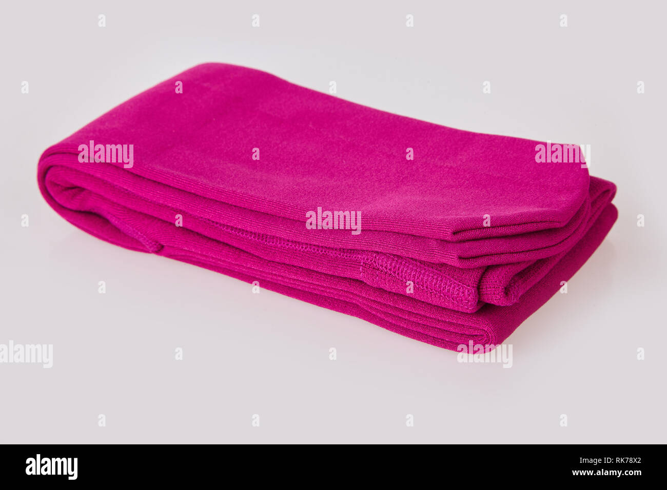 New folded child's tights isolated on white background Stock Photo - Alamy