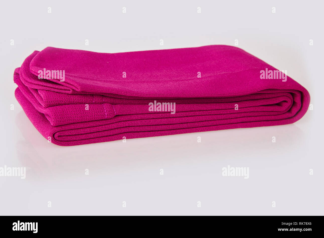 New folded child's tights isolated on white background Stock Photo - Alamy