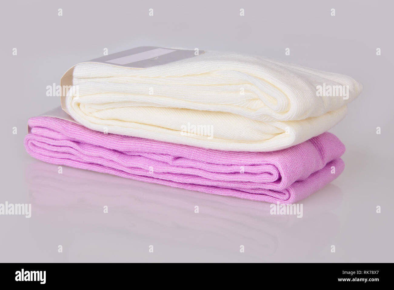 New folded child's tights isolated on white background Stock Photo - Alamy