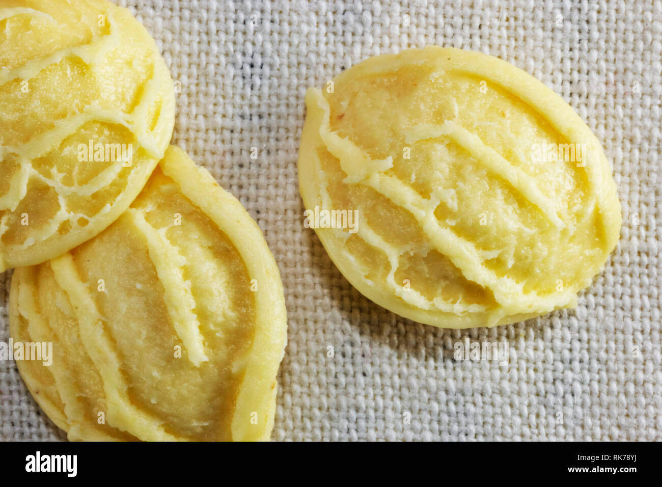 Orecchiette pasta on a white cloth ,a small ear shape pasta with the ...