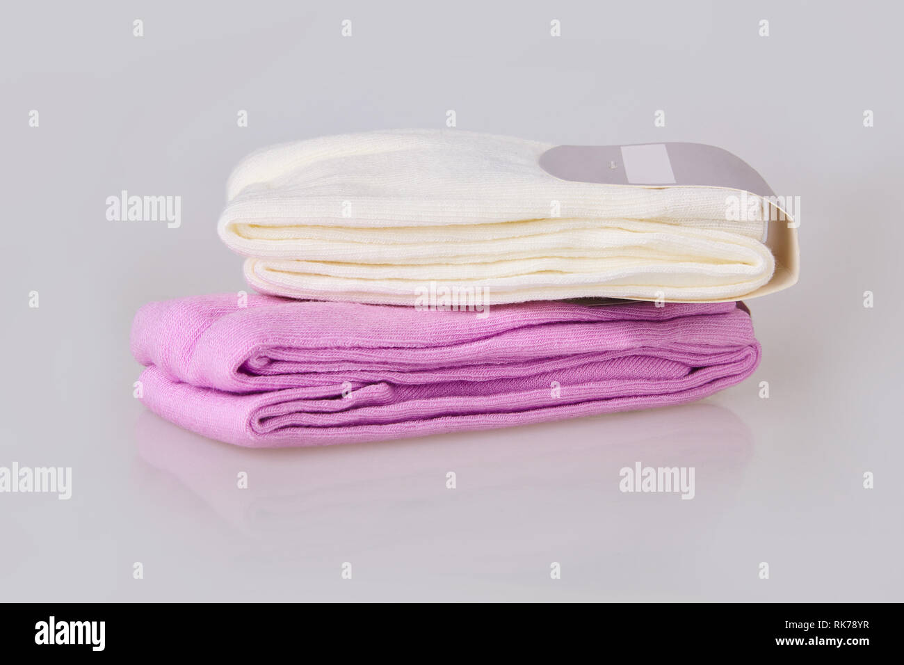 New folded child's tights isolated on white background Stock Photo - Alamy