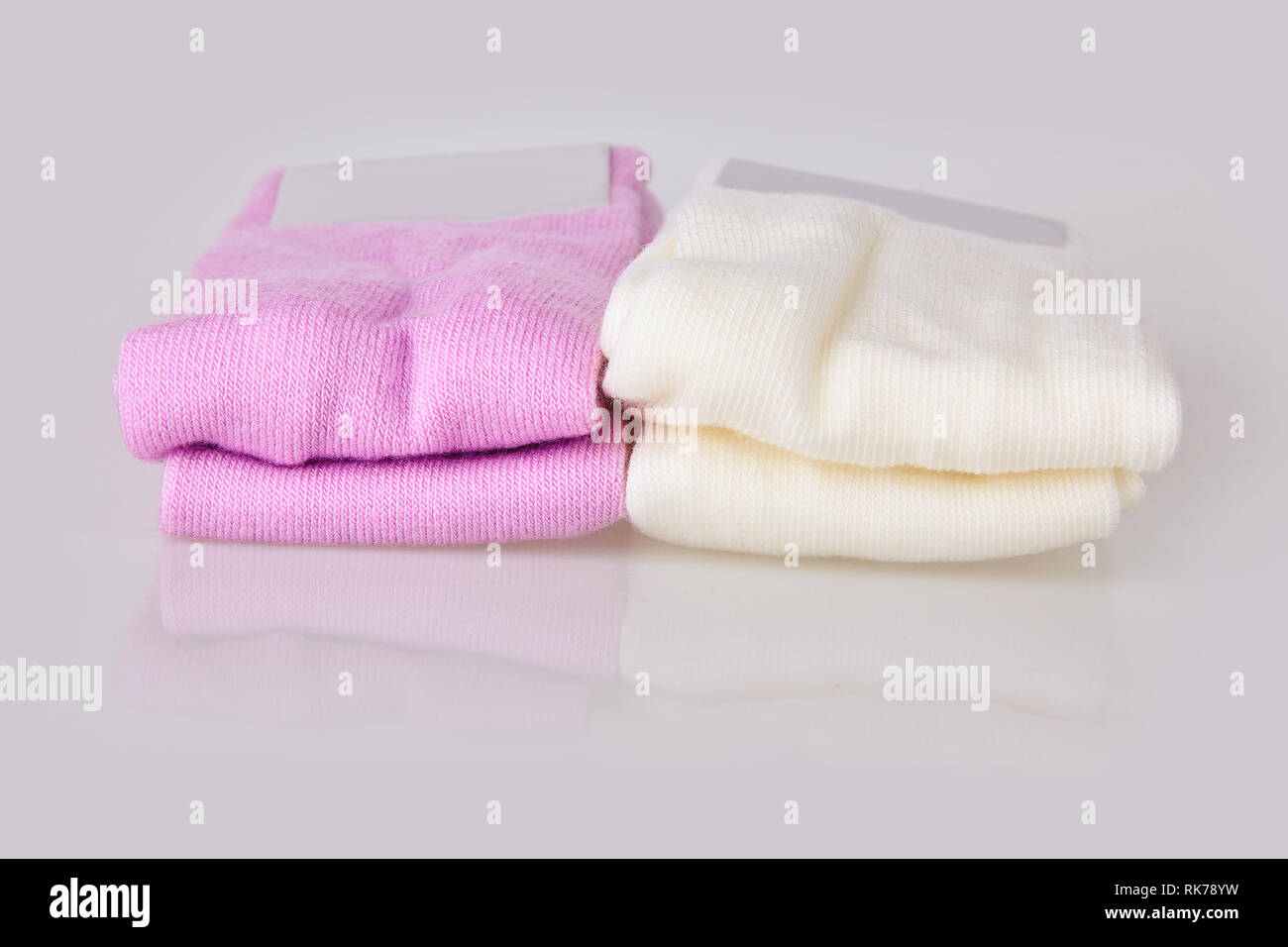 New folded child's tights isolated on white background Stock Photo - Alamy