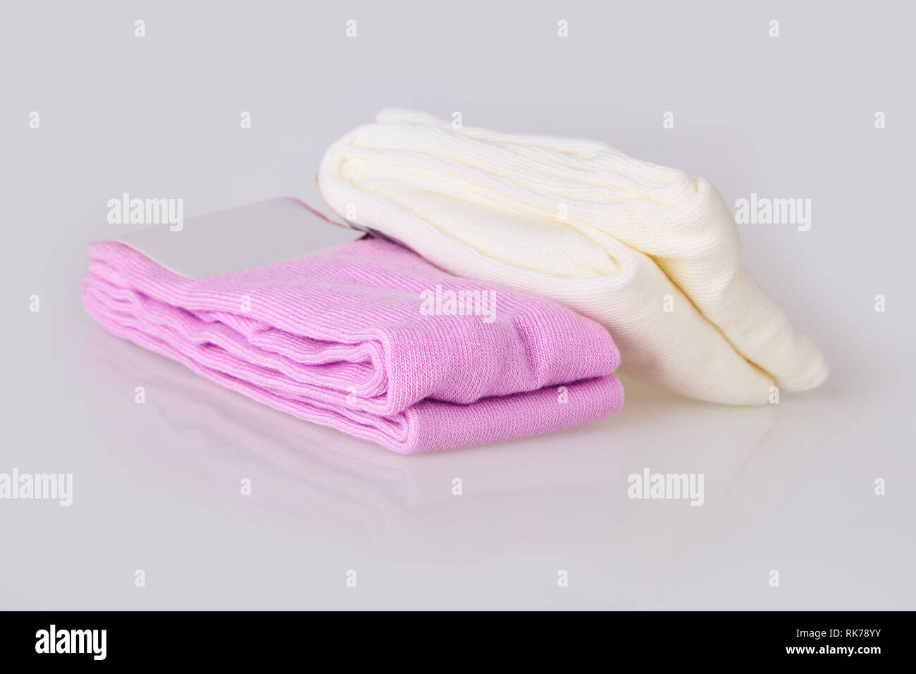 New folded child's tights isolated on white background Stock Photo - Alamy
