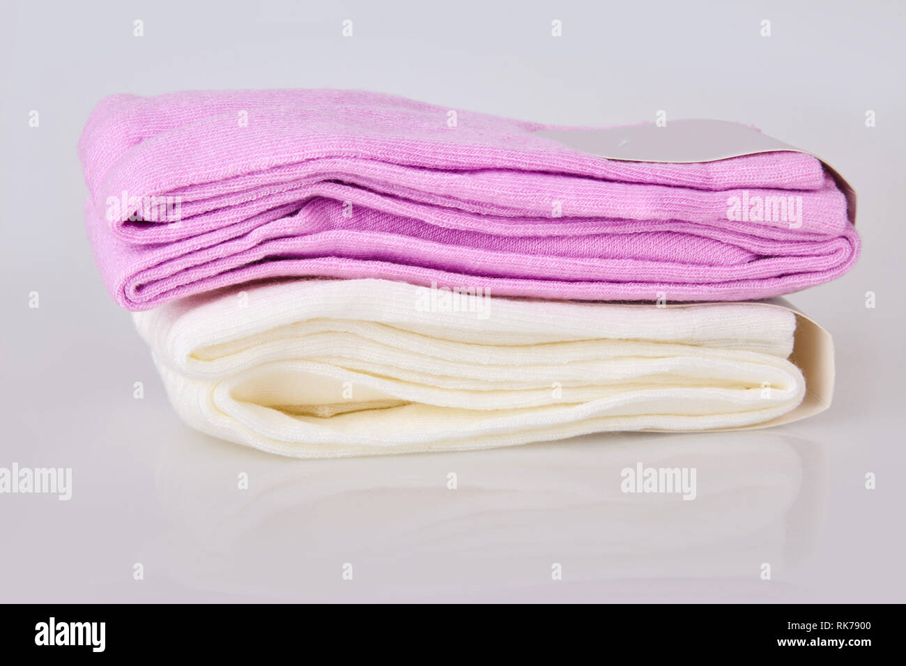 New folded child's tights isolated on white background Stock Photo - Alamy