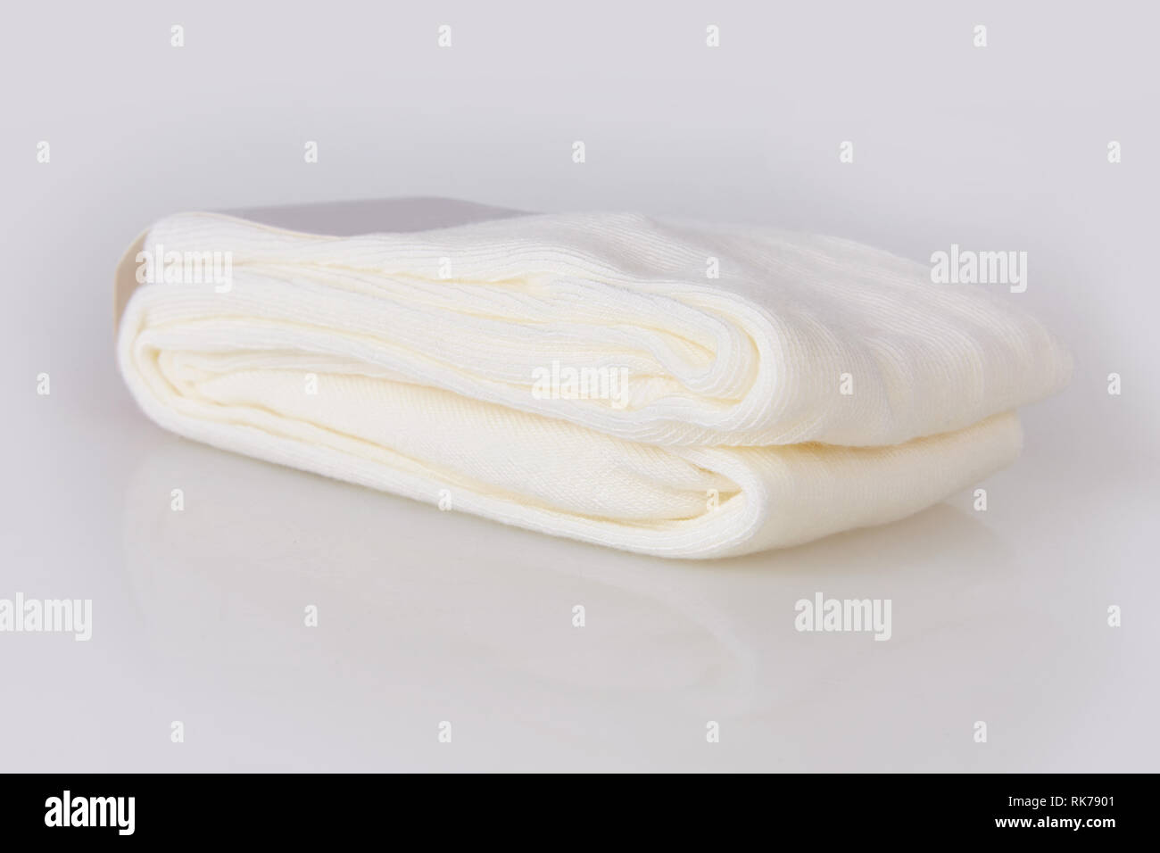 New folded child's tights isolated on white background Stock Photo - Alamy