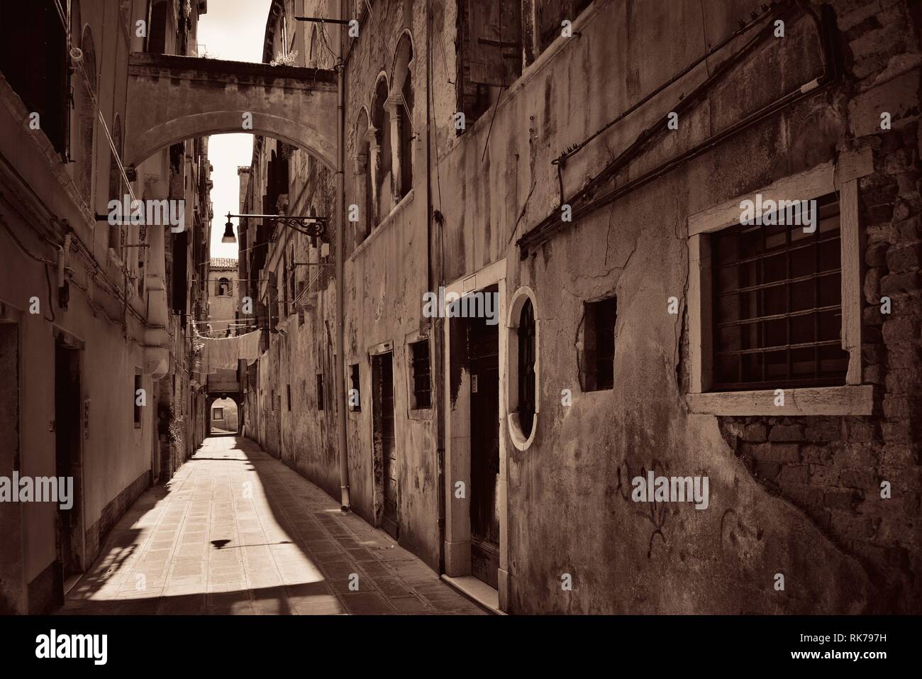 Alley view with arch and historical buildings in Venice, Italy Stock ...