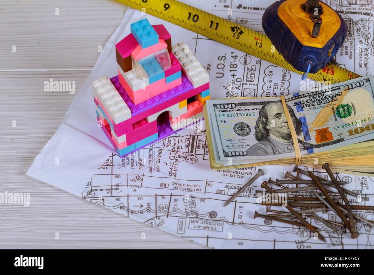 american money on architectural blueprints finances and one hundred ...