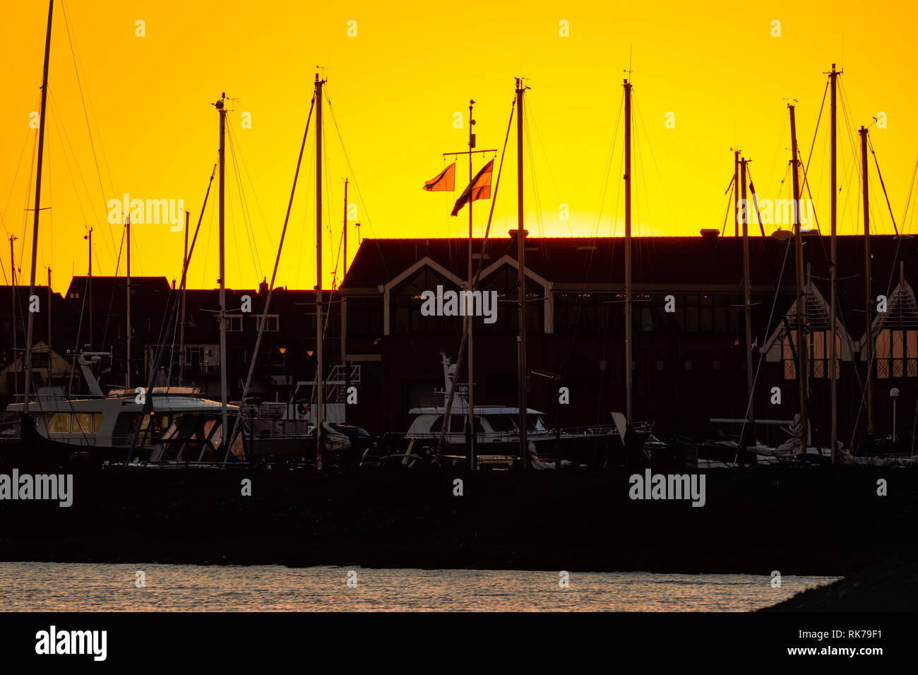 Sunset with skyline silhouet Urk, Dutch fishing village Stock Photo - Alamy