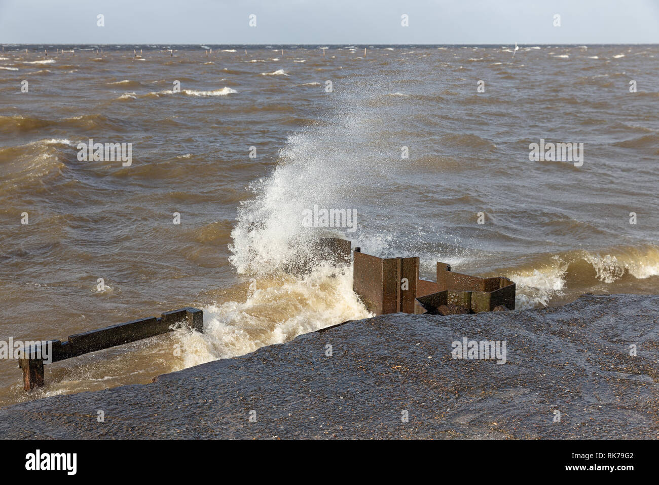 Dutch breakwater with breaking wave in heavy storm Stock Photo - Alamy