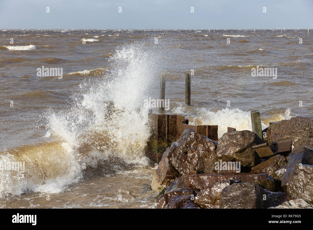 Dutch breakwater with breaking wave in heavy storm Stock Photo - Alamy
