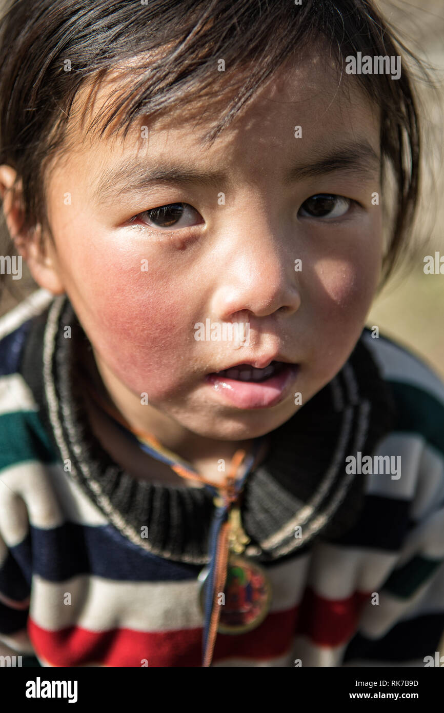 Portrait of a little girl from Laya, Gasa District, Snowman Trek ...