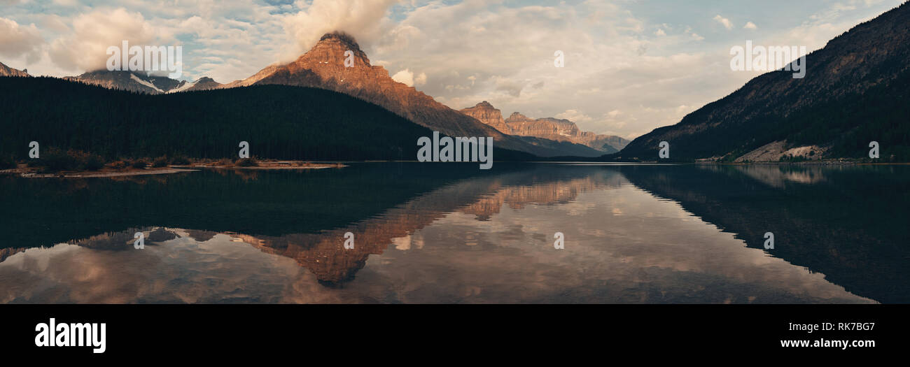 Lake at sunrise with cloud and mountain reflections in Banff National Park Stock Photo - Alamy