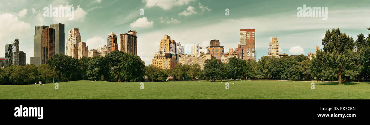 Central Park Spring with skyline in midtown Manhattan New York City ...