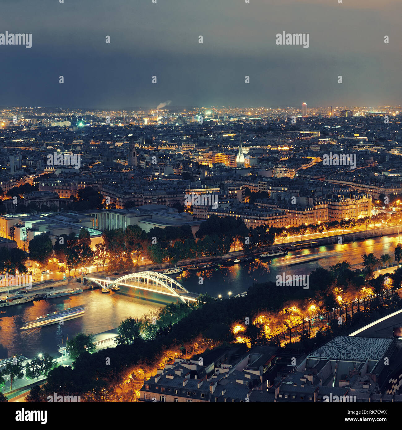 Paris city skyline rooftop view with River Seine at night, France Stock ...