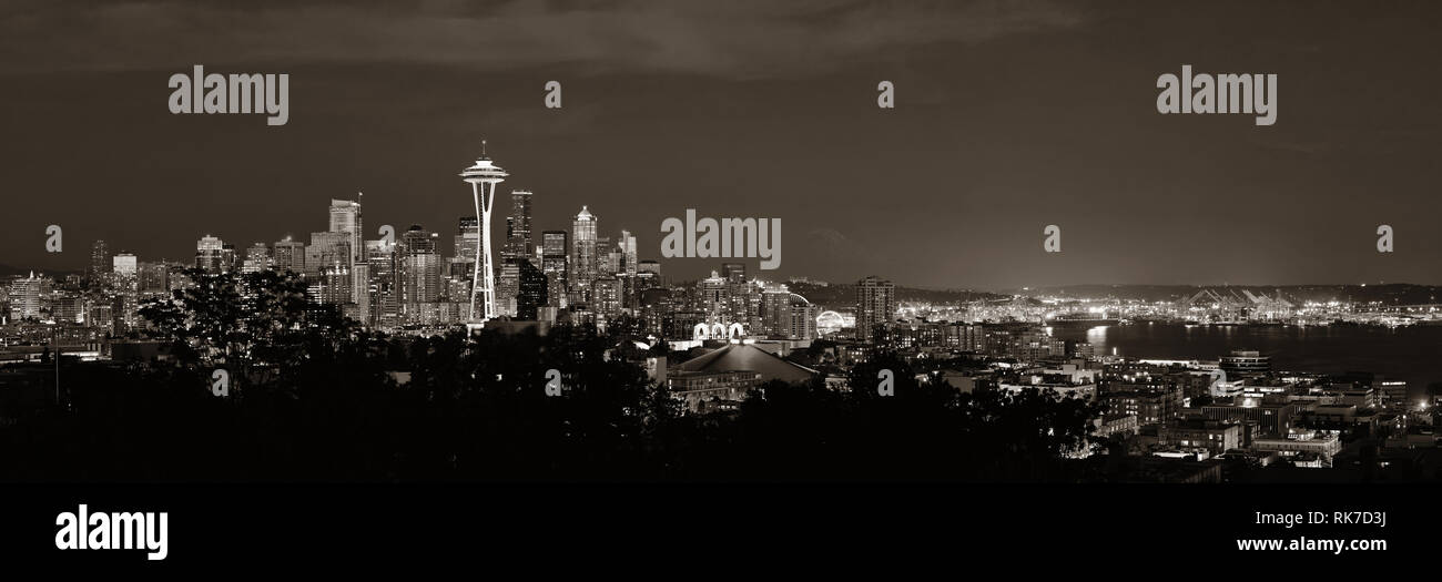 Seattle city skyline at night with urban office buildings viewed from ...