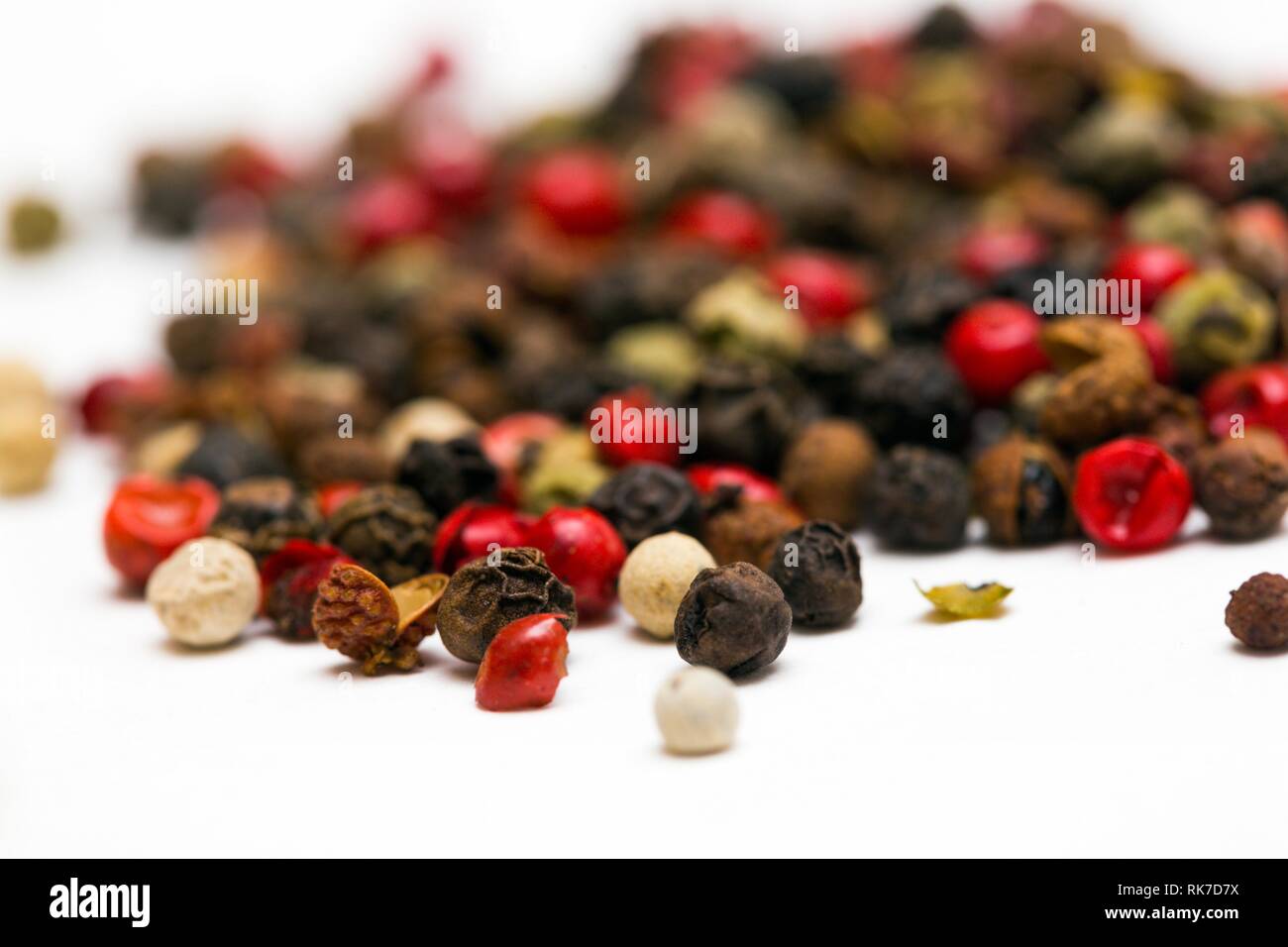 herbs and spices. heap fragrant peppers mix on a white background Stock ...