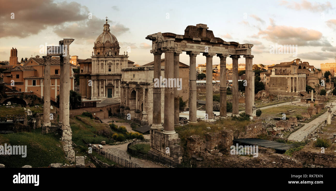 Rome Forum with ruins of ancient architecture at sunset with colorful ...