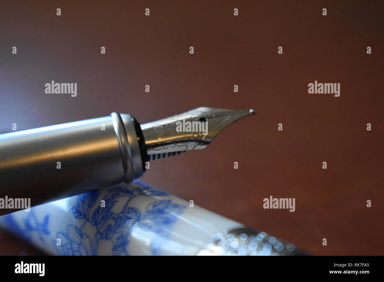 water fountain pen set with blue flower cover Stock Photo - Alamy