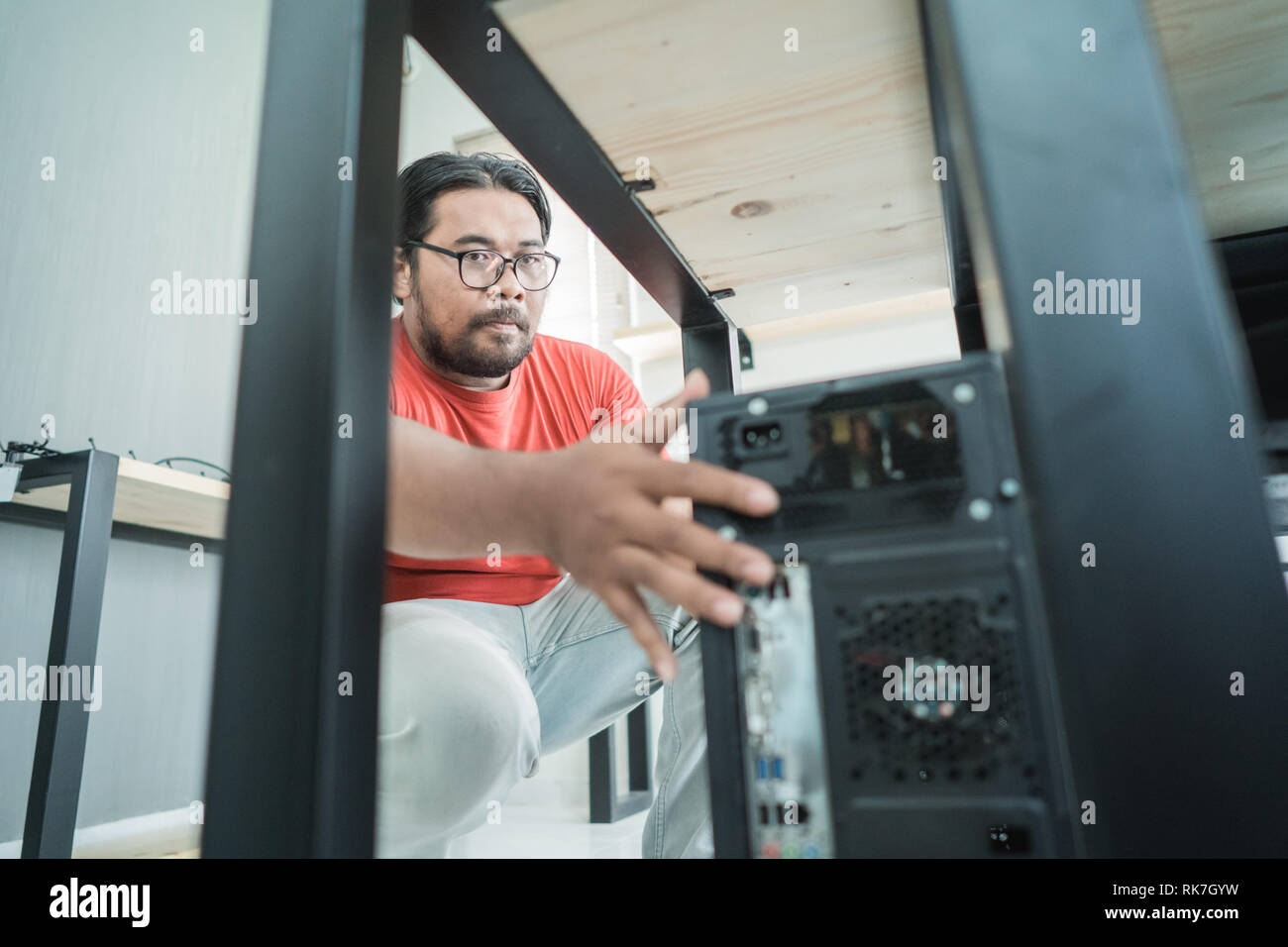 portrait of technician install a new hardware a part of personal ...