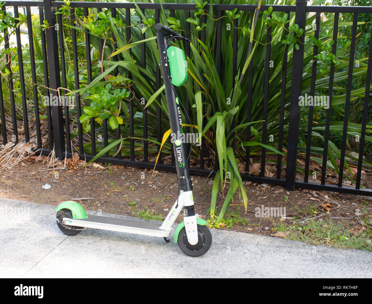 Lime Scooter Parked On The Footpath Stock Photo - Alamy