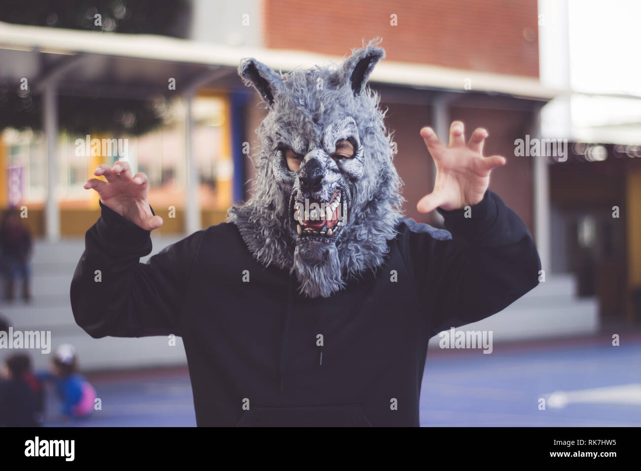 Photograph of a person with a wolf mask Stock Photo - Alamy