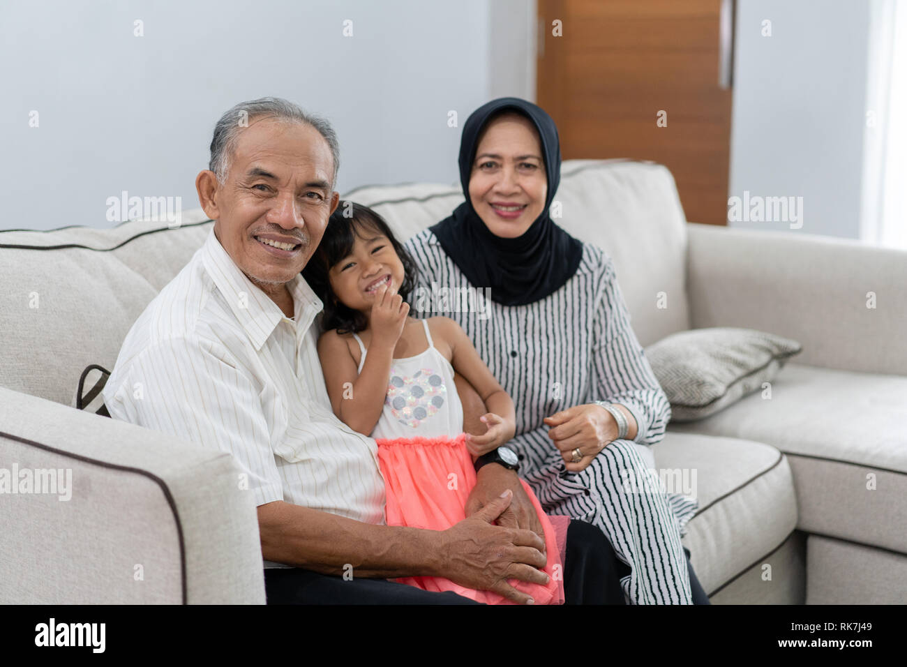 asian muslim family. portrait of happy grandparent with their ...