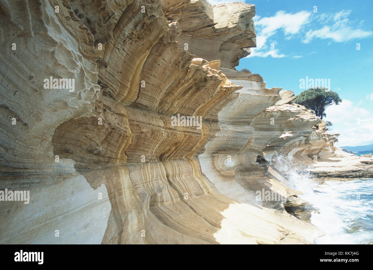 Sandstone cliffs, weathered by wave action, on the northern shores of ...