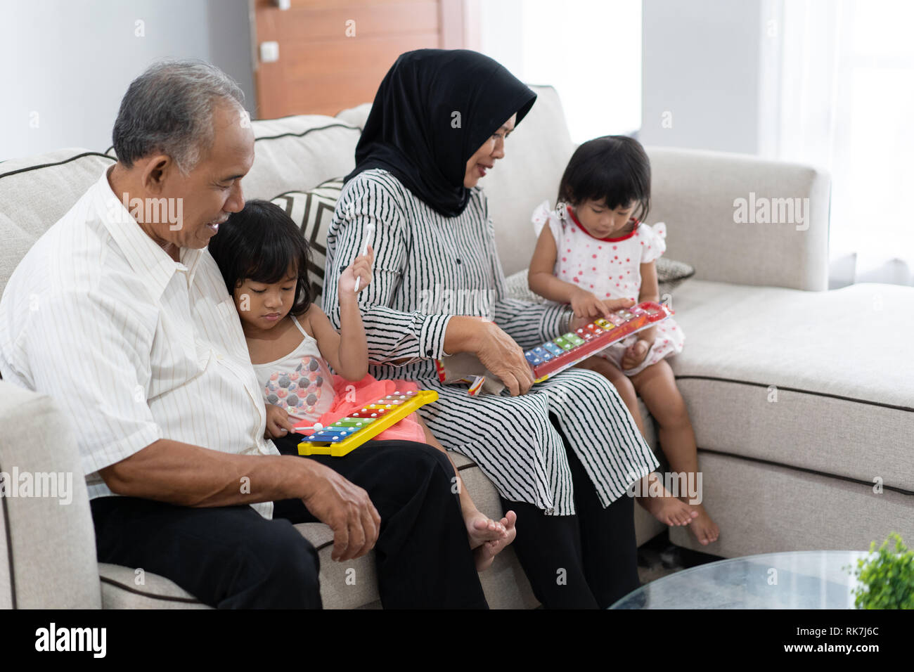 portrait of beautiful asian grandparent with their granddaughters in ...