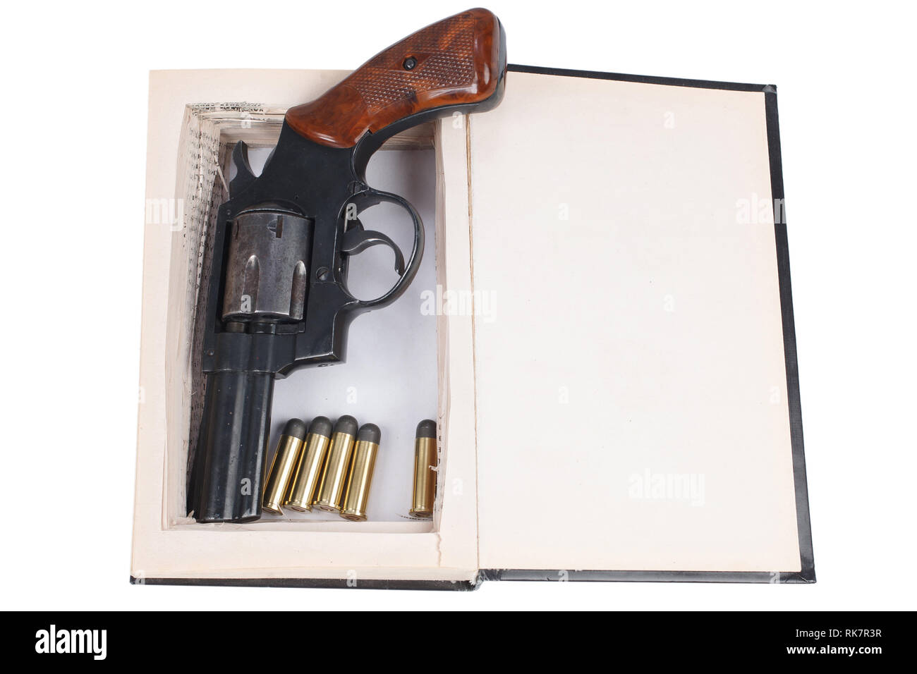 A gun hidden inside a book isolated on white background Stock Photo - Alamy