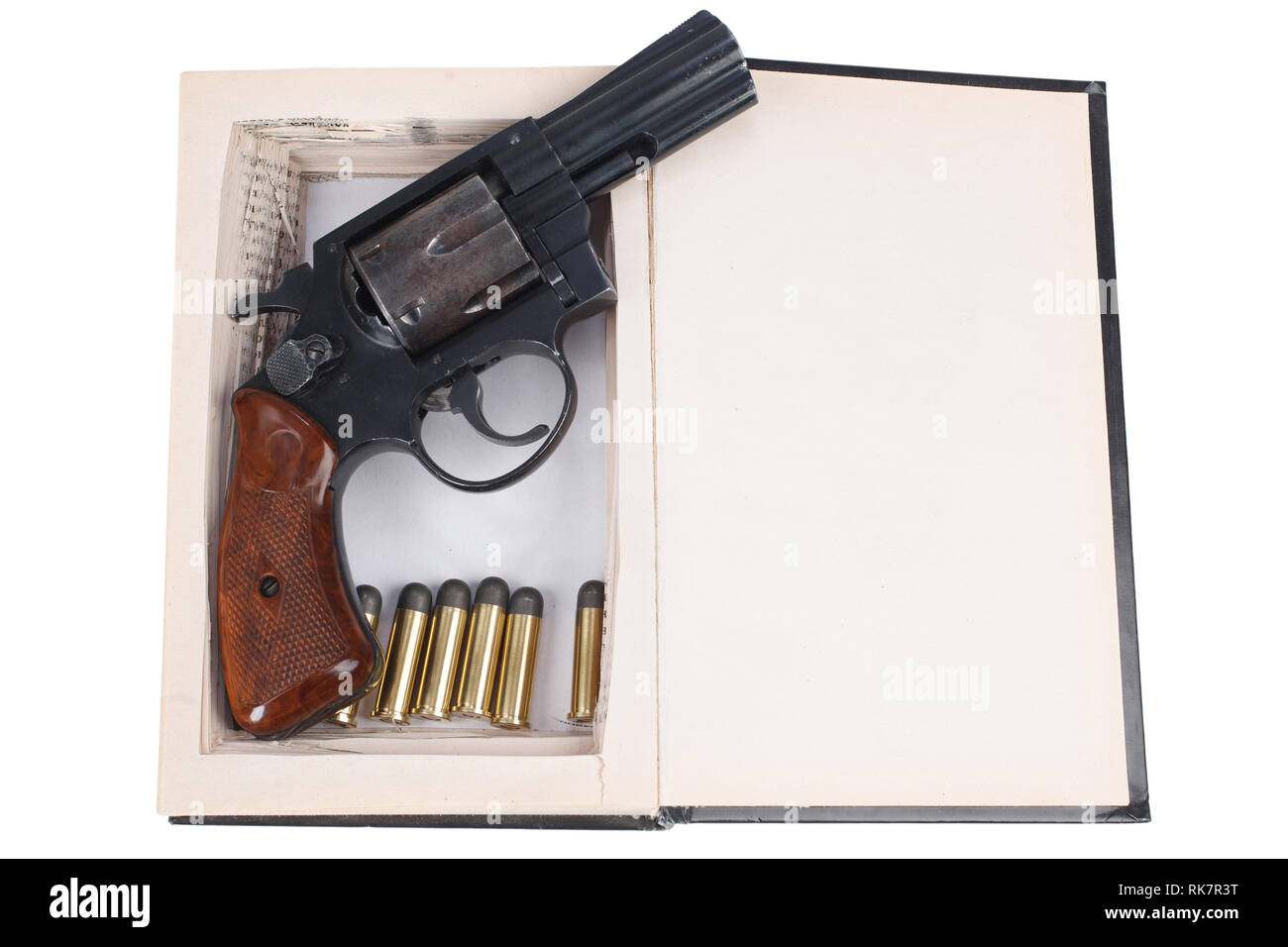 A gun hidden inside a book isolated on white background Stock Photo - Alamy