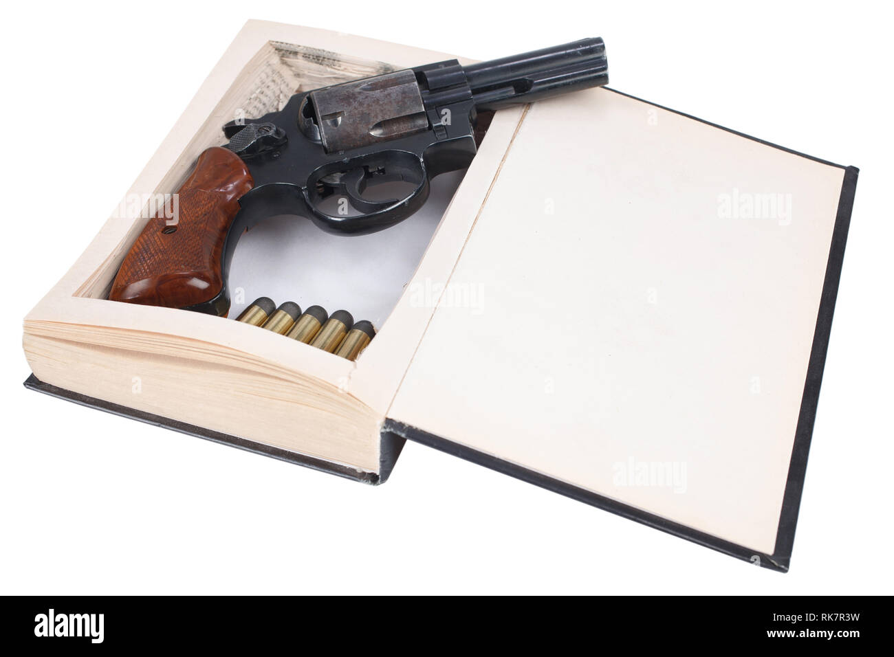 A gun hidden inside a book isolated on white background Stock Photo - Alamy