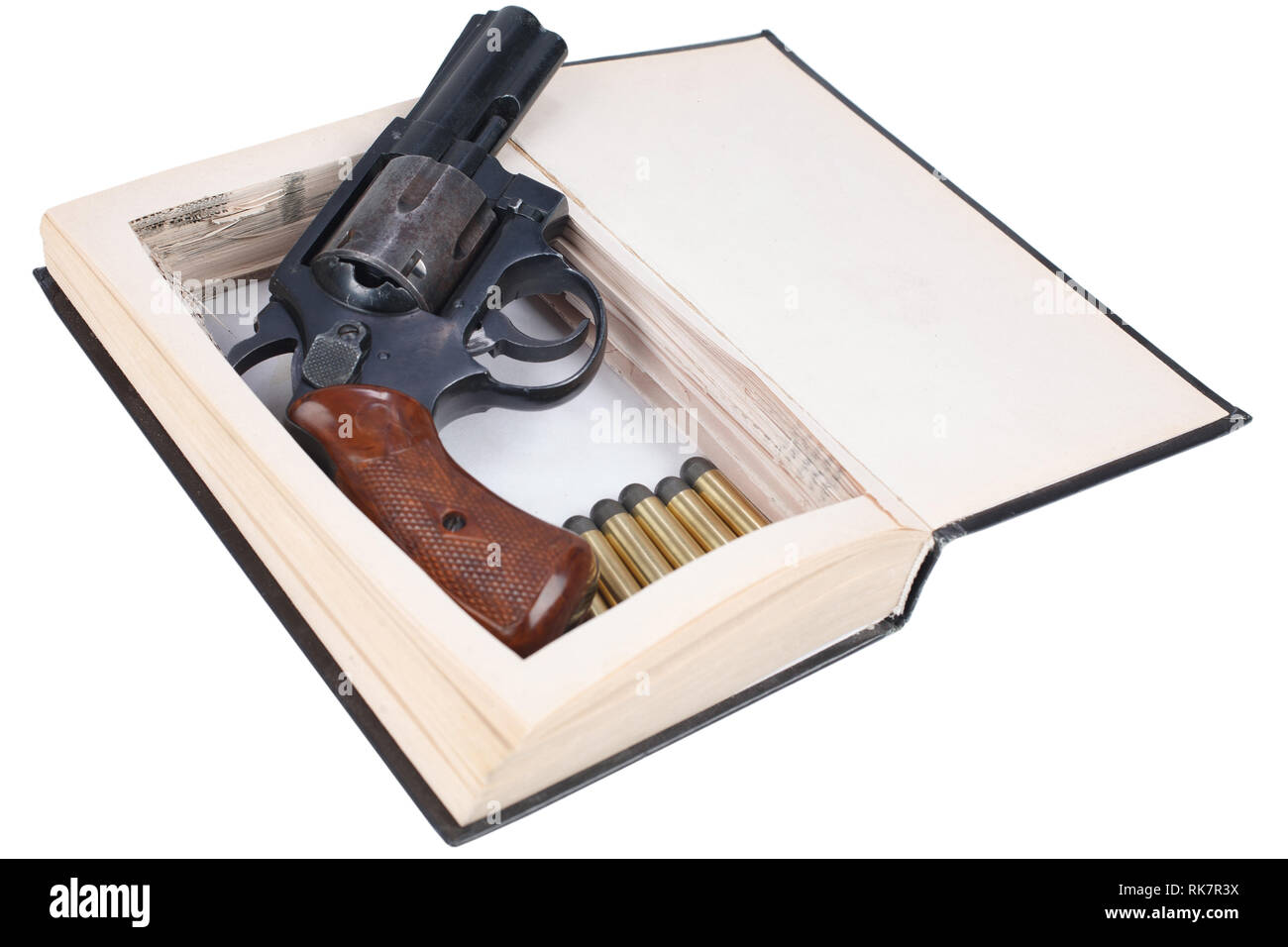 A gun hidden inside a book isolated on white background Stock Photo - Alamy
