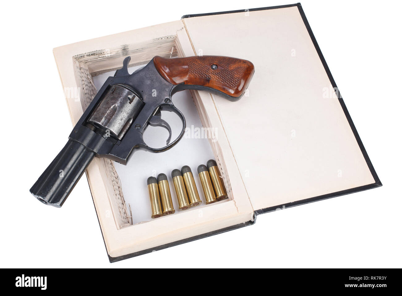 A gun hidden inside a book isolated on white background Stock Photo - Alamy