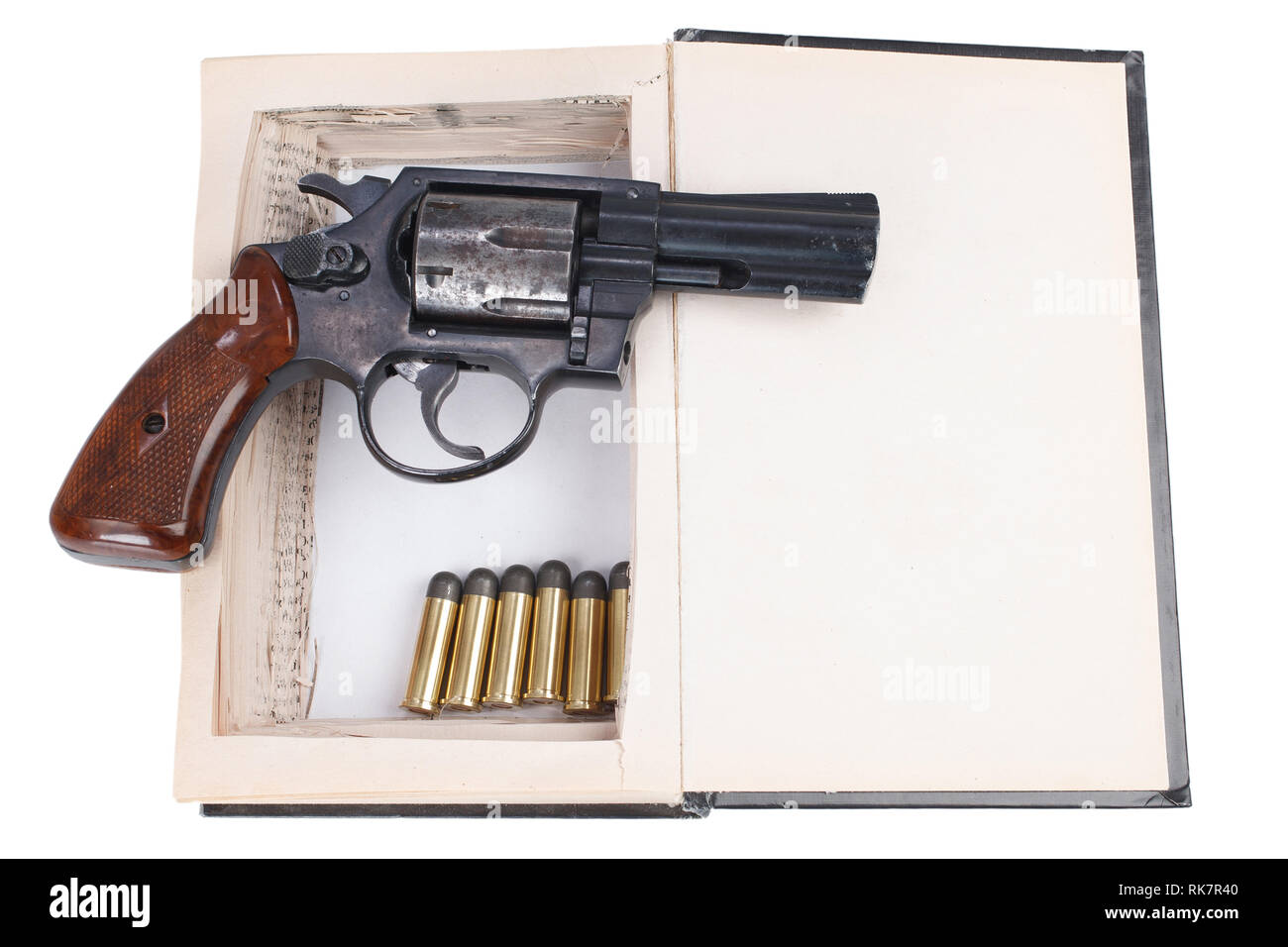 A gun hidden inside a book isolated on white background Stock Photo - Alamy