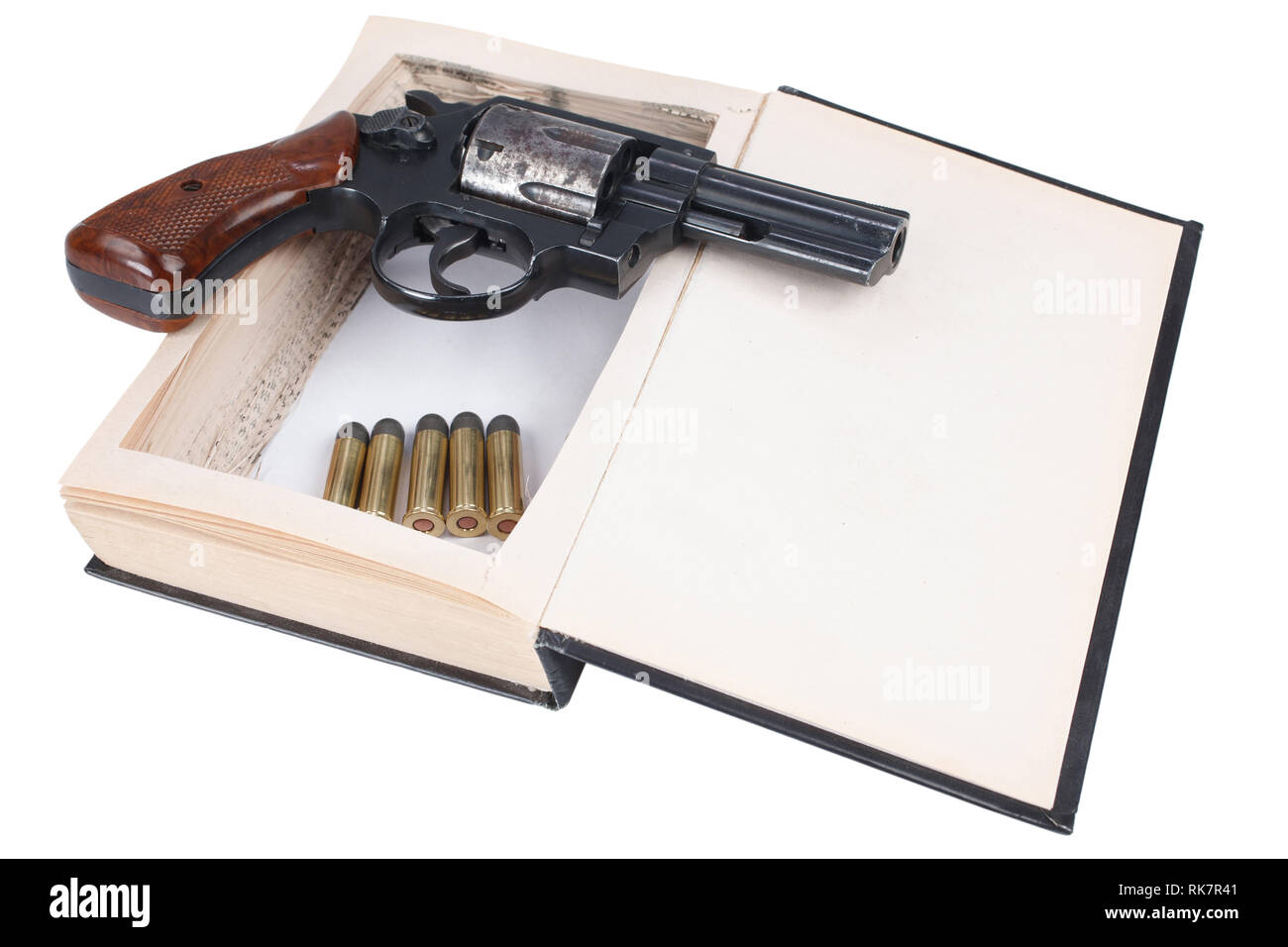 A gun hidden inside a book isolated on white background Stock Photo - Alamy