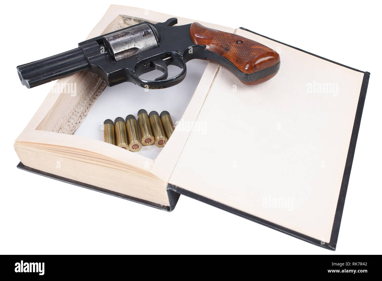 A gun hidden inside a book isolated on white background Stock Photo - Alamy