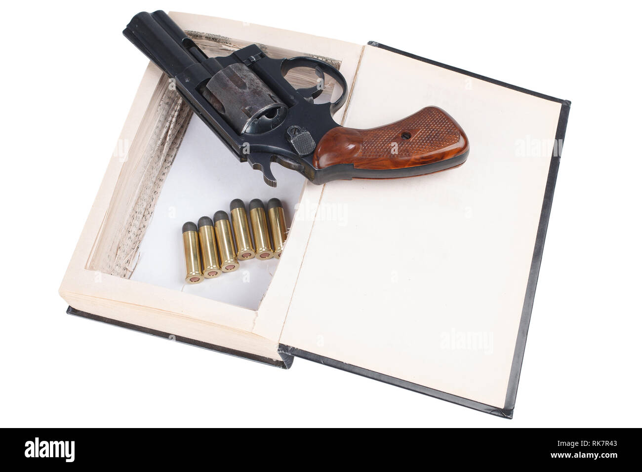 A gun hidden inside a book isolated on white background Stock Photo - Alamy