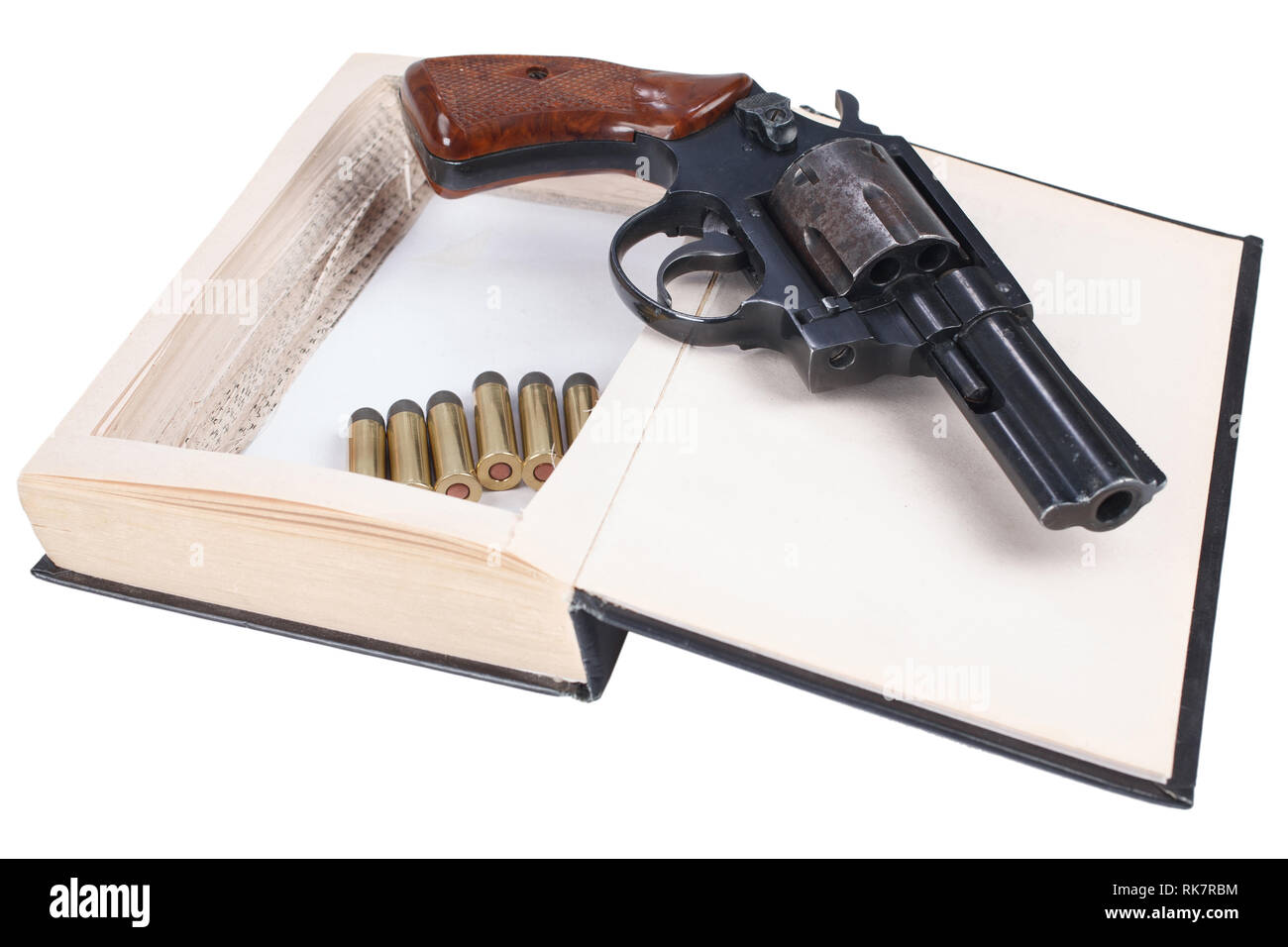 A gun hidden inside a book isolated on white background Stock Photo - Alamy