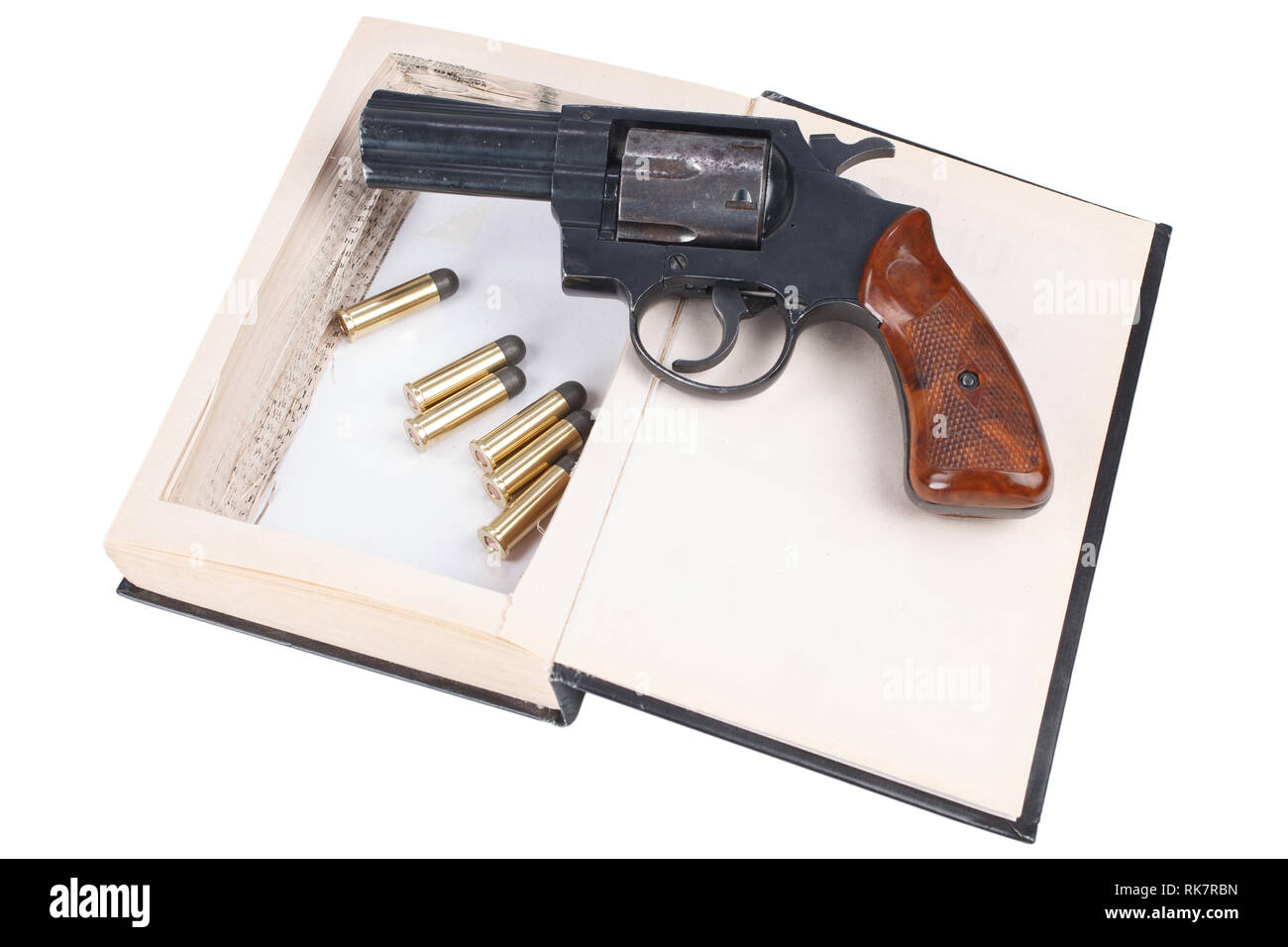 A gun hidden inside a book isolated on white background Stock Photo - Alamy