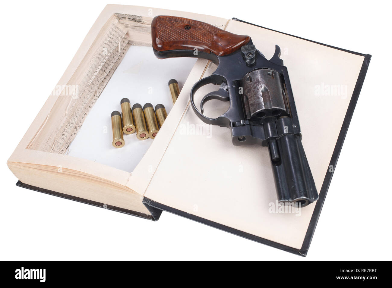 A gun hidden inside a book isolated on white background Stock Photo - Alamy