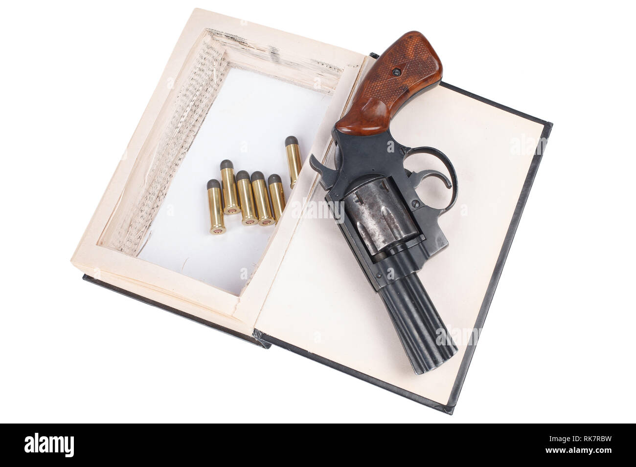 A gun hidden inside a book isolated on white background Stock Photo - Alamy