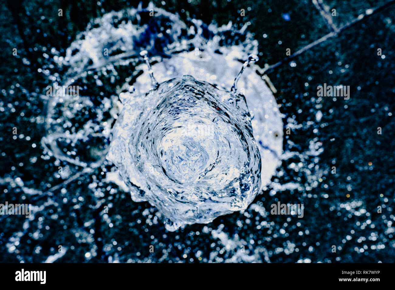 Water jet going up towards the camera, blue tones, background for ...