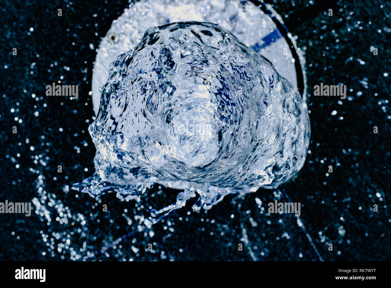 Water jet going up towards the camera, blue tones, background for ...