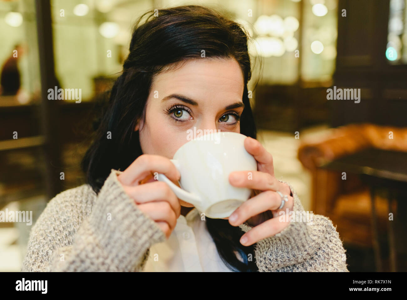 Pretty brunette woman drinking coffee in Vienna, European city, during a trip Stock Photo - Alamy