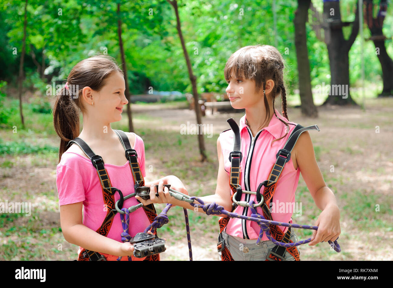 adventure climbing high wire park - hiking in rope park two girls Stock ...