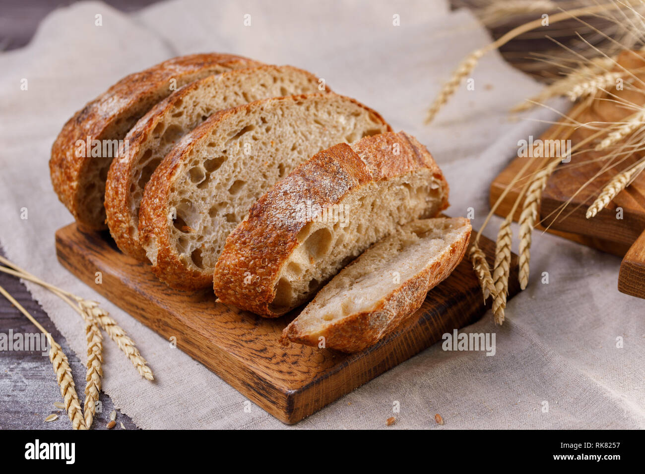 Sliced craft bread on a board close-up. The concept of healthy food and ...