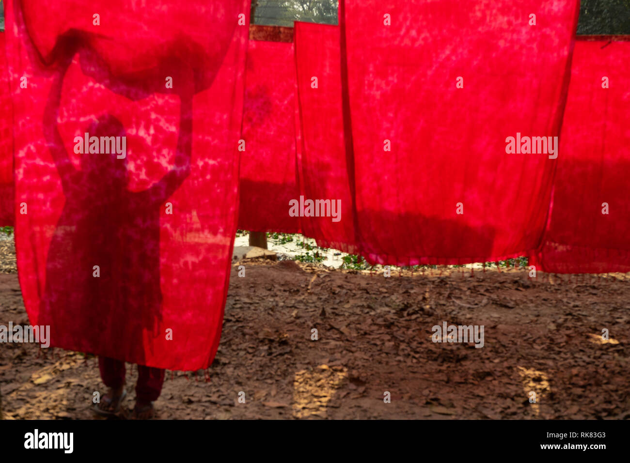 The old man colored threads are drying through conventional way under ...