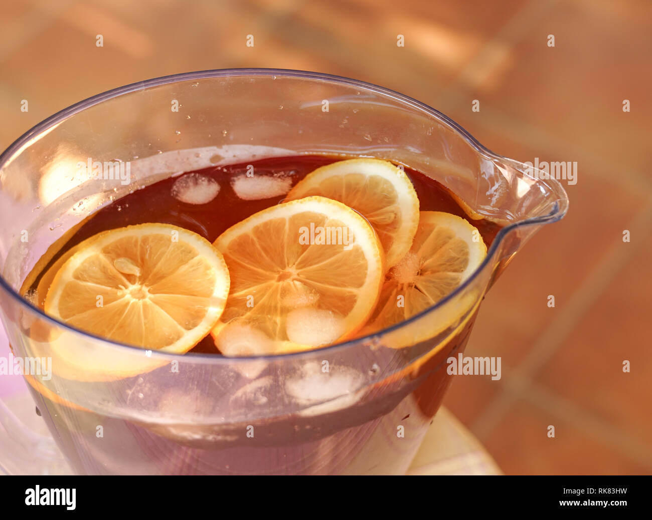 Jug of lemon tea with ice on a hot day to quench thirst Stock Photo - Alamy