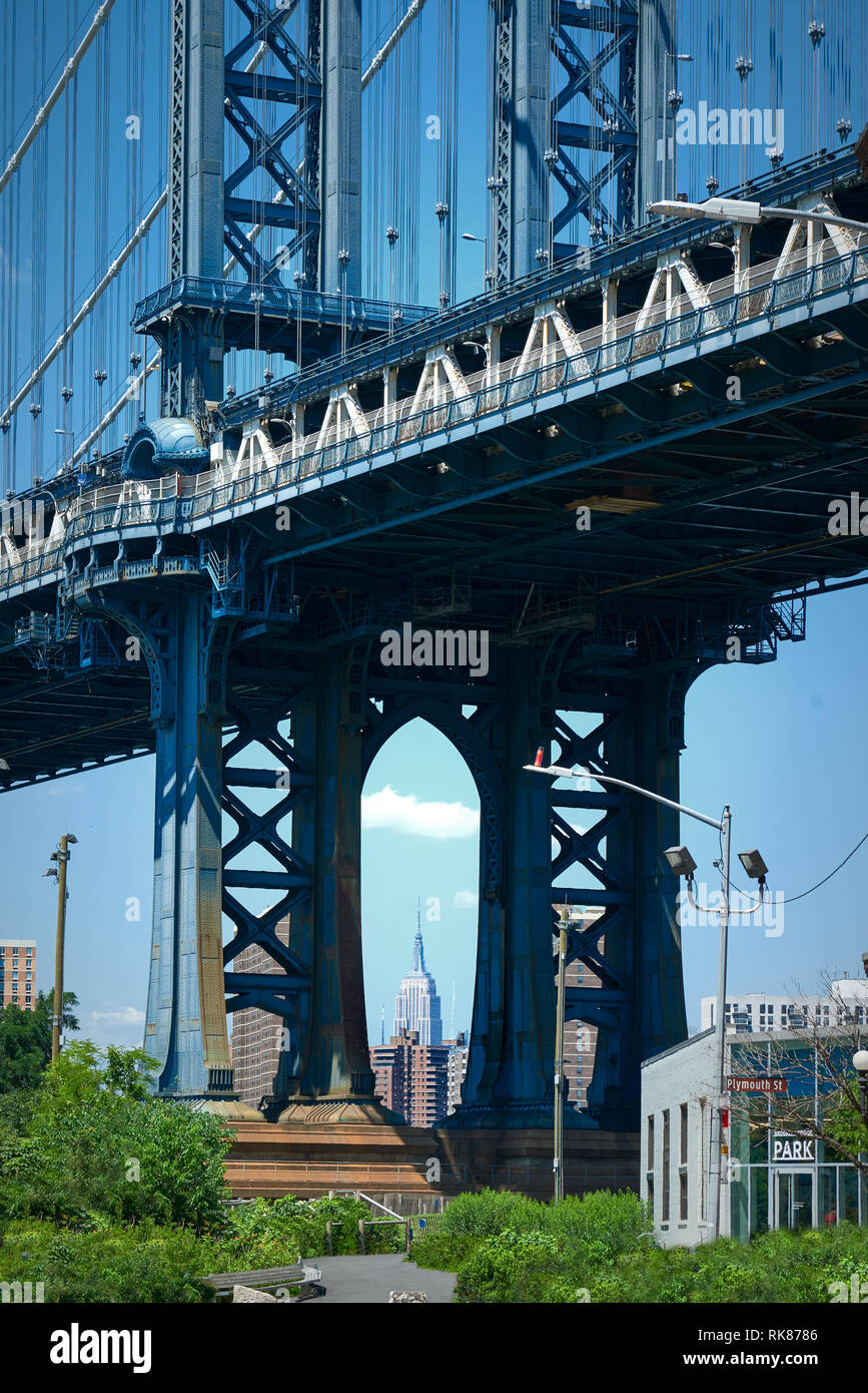 Empire State building seen through Manhattan Bridge Stock Photo - Alamy
