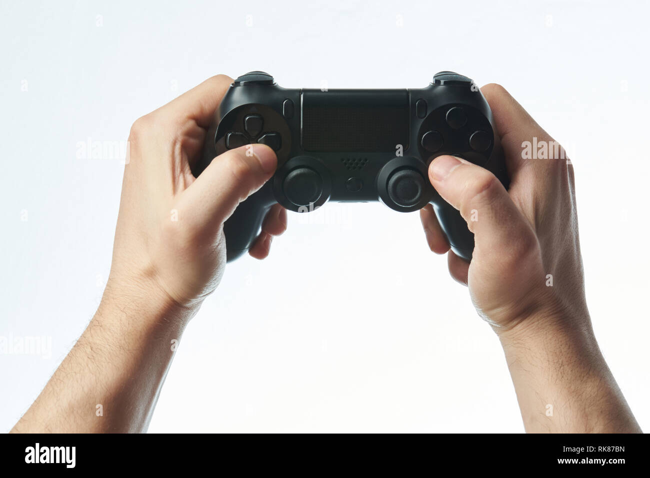Holding game joystick in hands isolated on white background Stock Photo ...